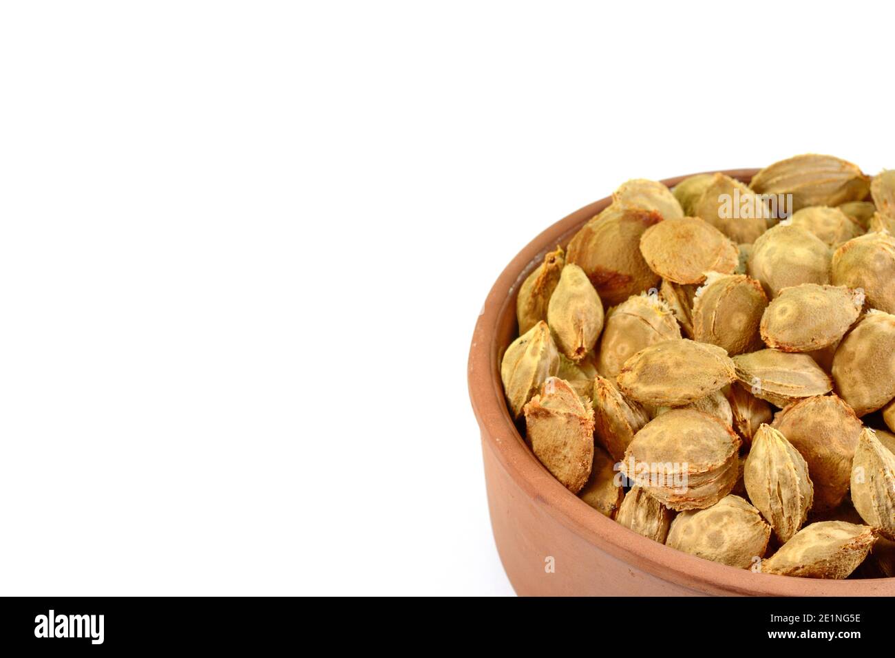 Dry apricot nut on white background Stock Photo - Alamy