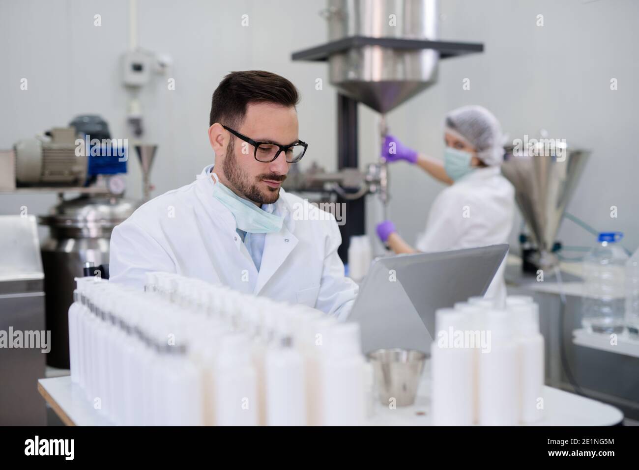 Scientist using laptop entering hi-res stock photography and images - Alamy