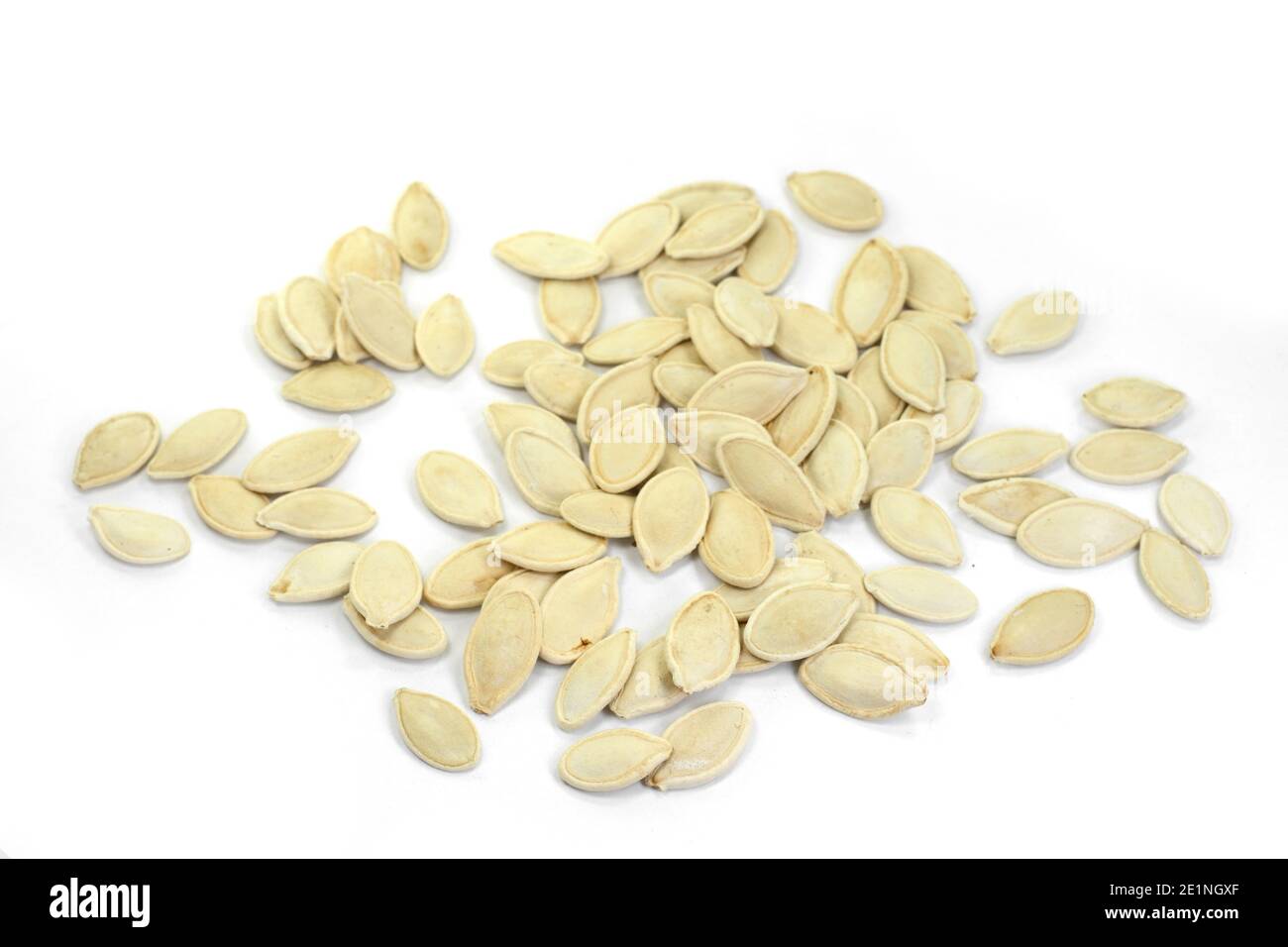 Heap of pumpkin seeds isolated on white background Stock Photo - Alamy