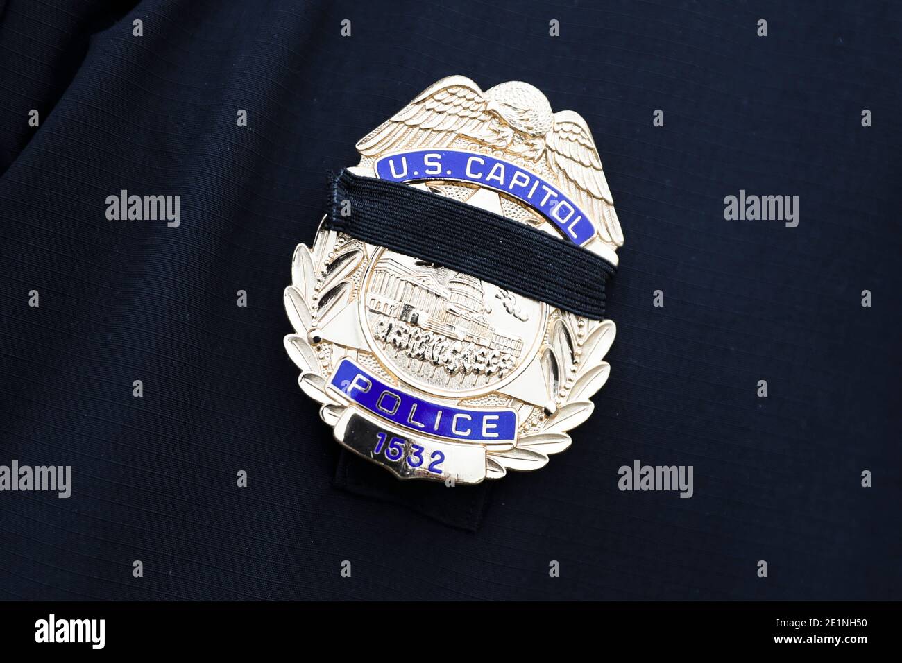 Washington, USA. 08th Jan, 2021. A Capitol police badge is covered with ...
