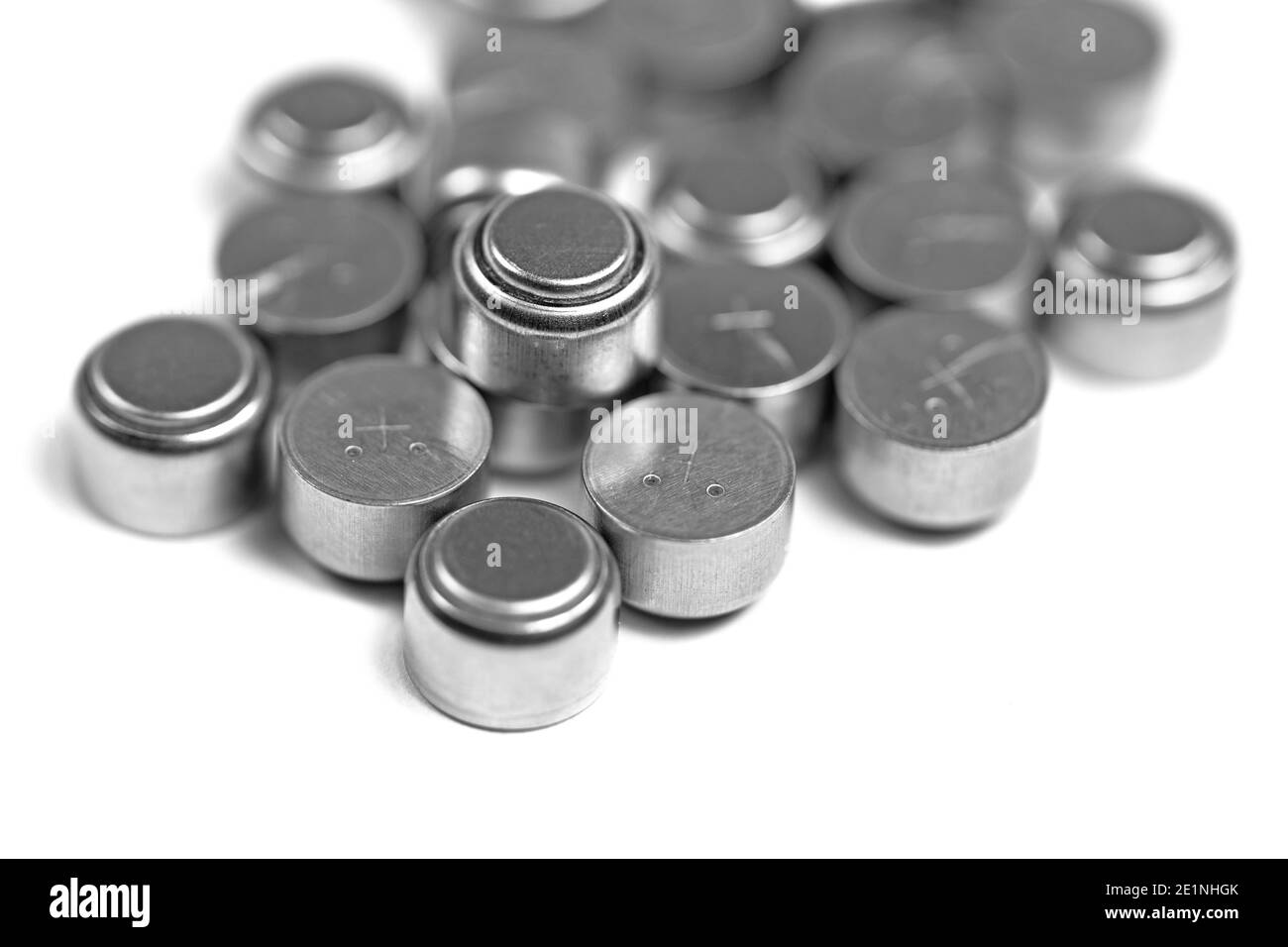 Various button cells against a white background Stock Photo - Alamy