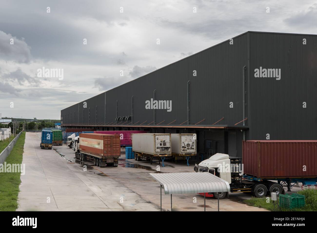Truck is carrying container parking in front warehouse Stock Photo - Alamy
