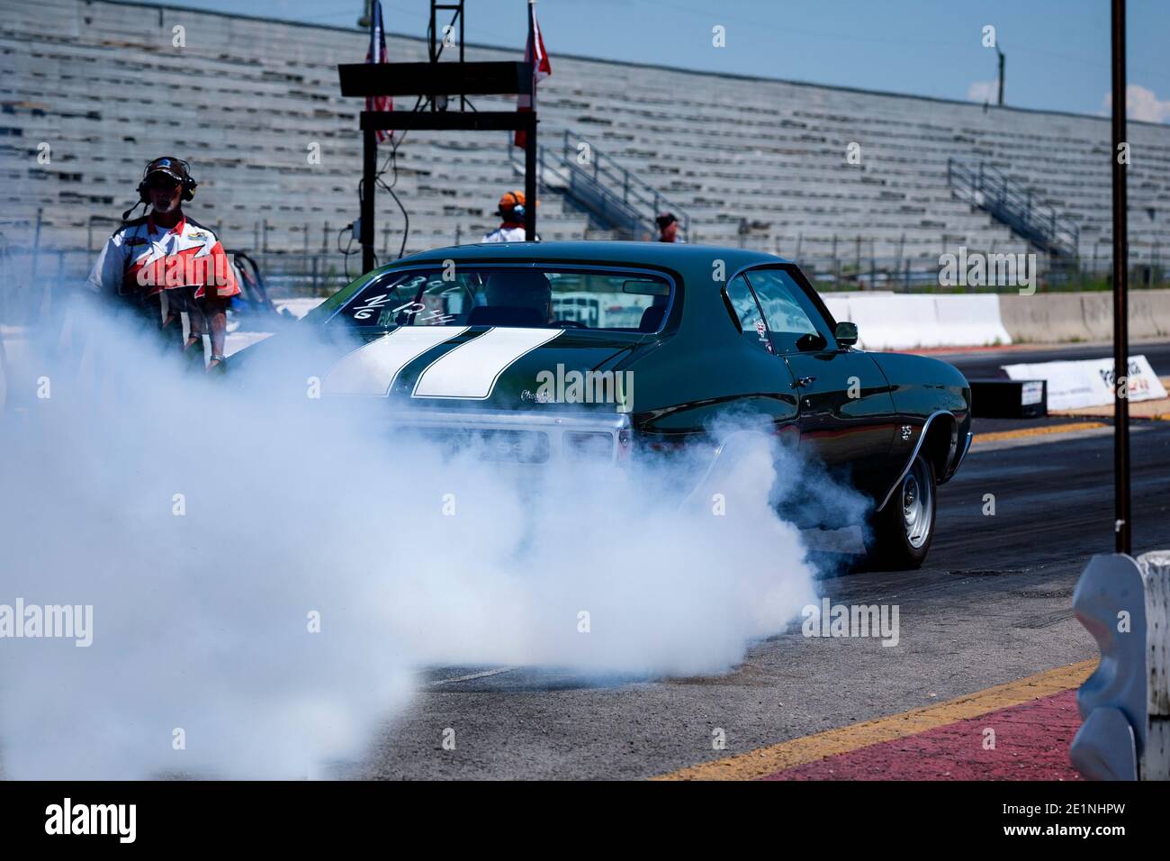 Chevrolet Chevelle performing a burnout at drag strip Stock Photo - Alamy