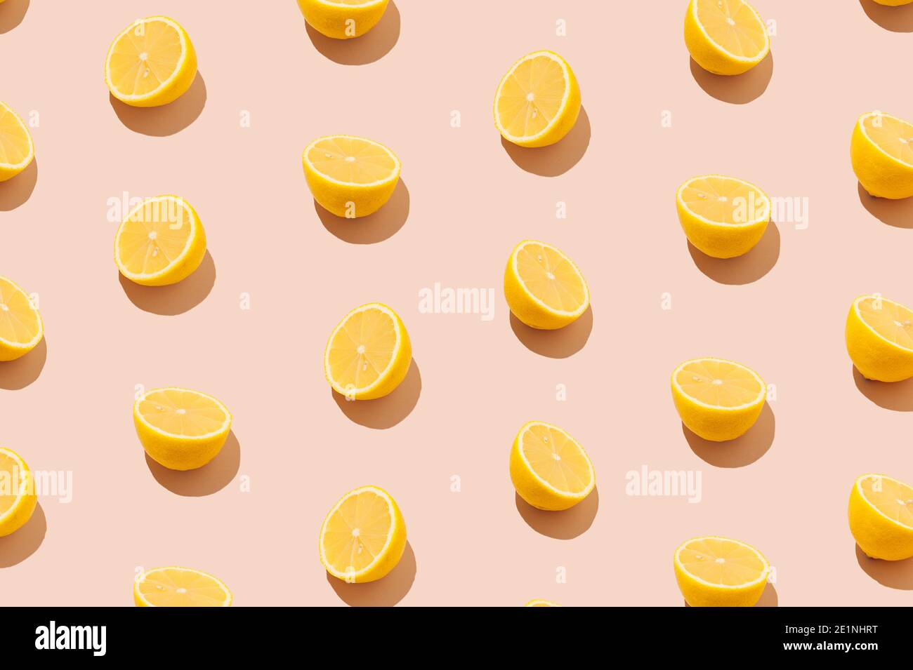 Creative pattern made with fresh lemon slices on the beige pastel ...