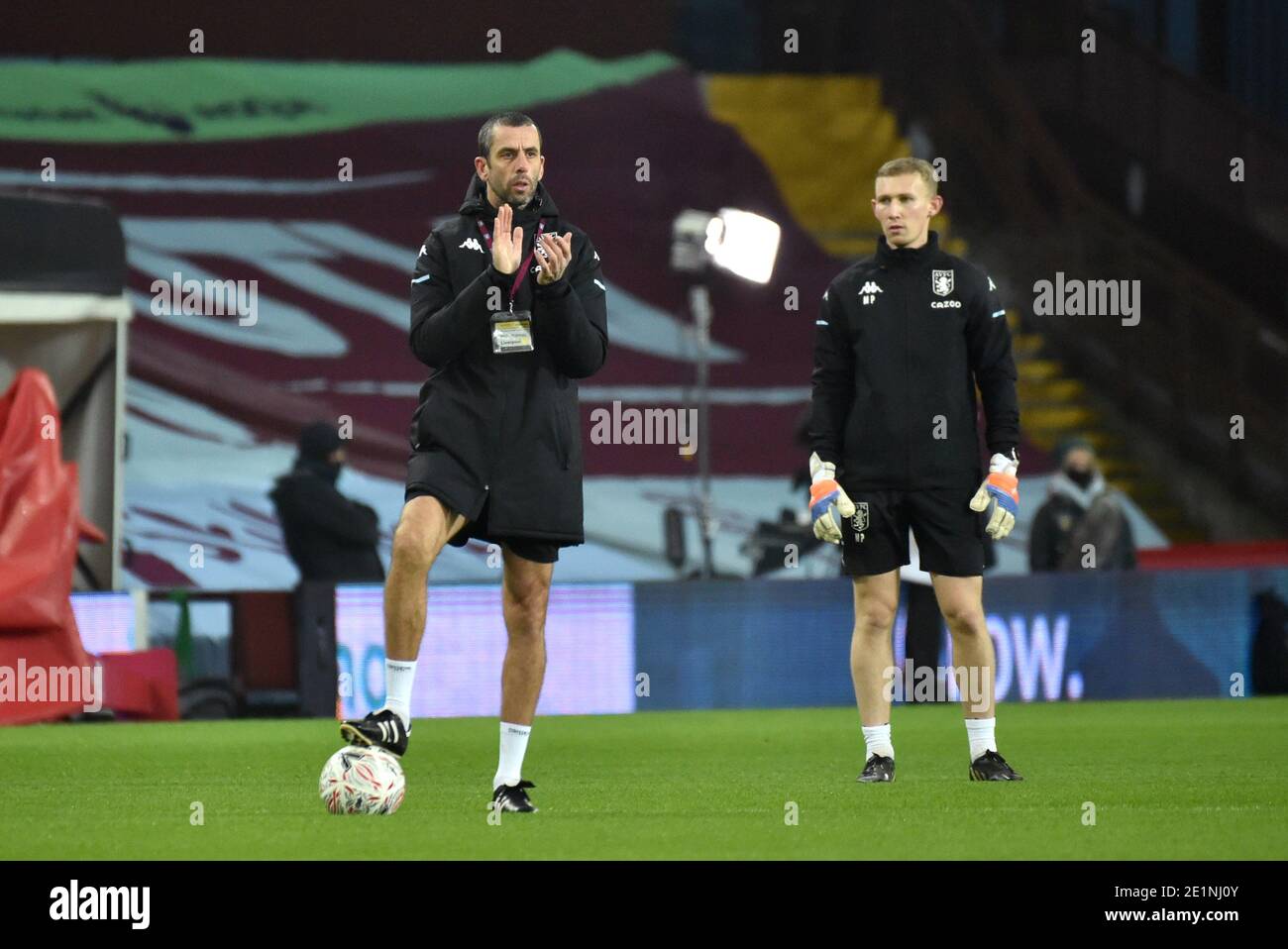 Aston Villa Under-23 manager Mark Delaney (left) watches over the warm ...