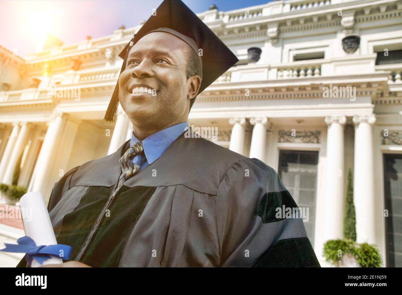 African American Graduate with Diploma in Front of University Building ...