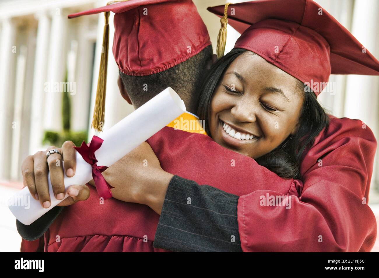 Photo of woman hugging boyfriend after graduation Stock Photo - Alamy