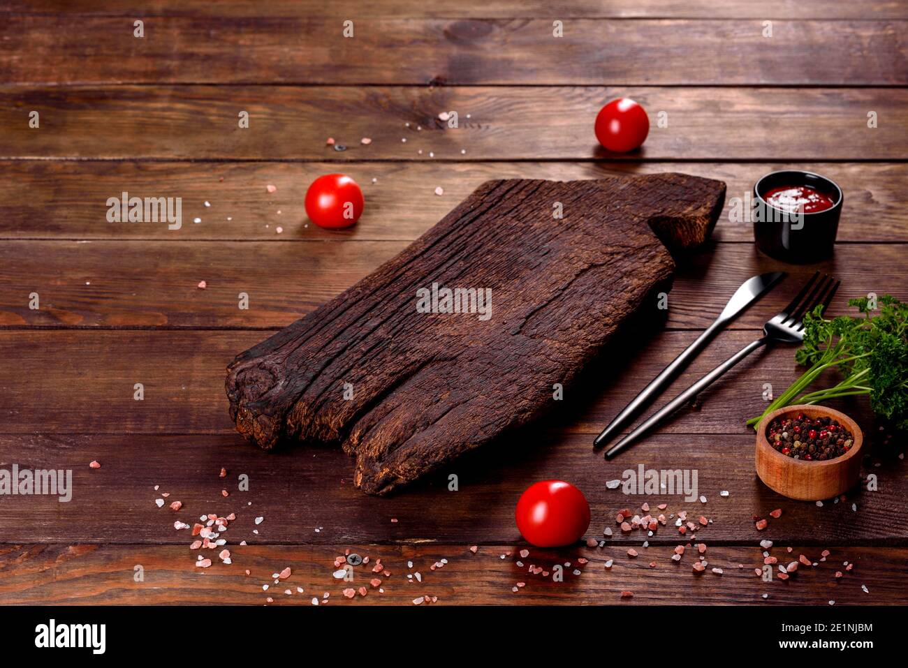 Cutting wooden board as well as vegetables and a special dark table ...
