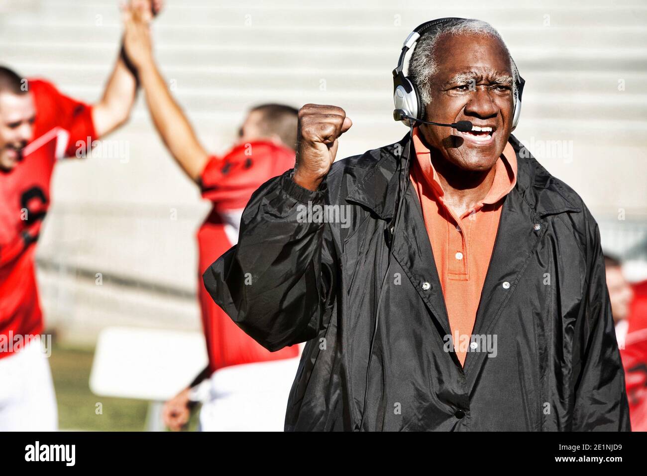 Happy american football coach celebrating goal Stock Photo - Alamy