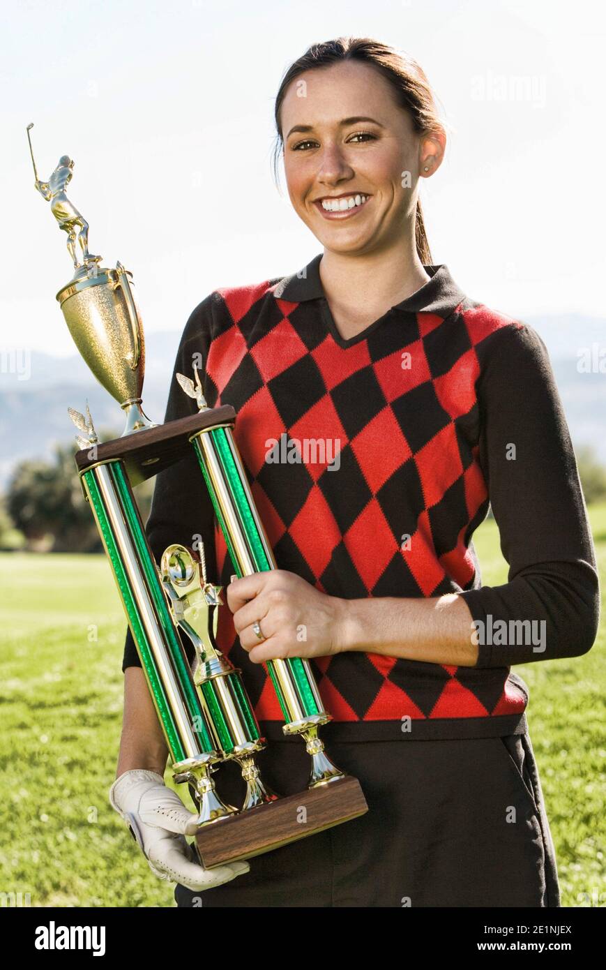 Portrait of Female Golf Champion Holding Trophy Stock Photo - Alamy