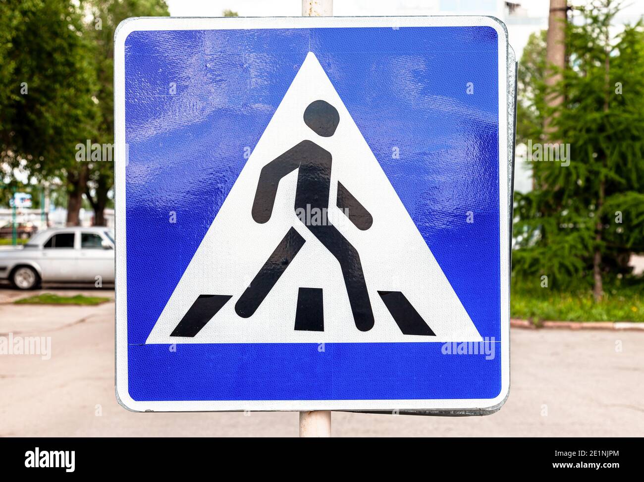 Pedestrian crossing warning traffic sign in blue, close up Stock Photo ...