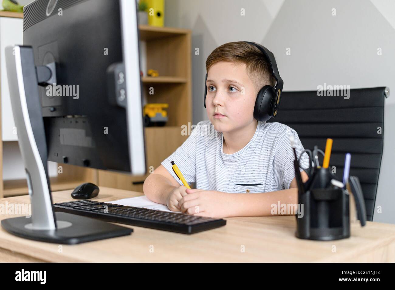 Teenage boy watching computer screen hi-res stock photography and ...