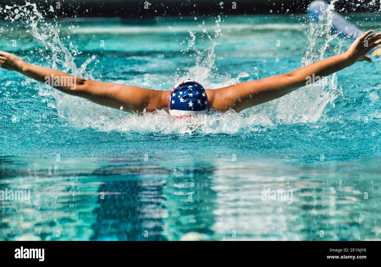Portrait of Woman Swimming Butterfly Stroke Stock Photo - Alamy