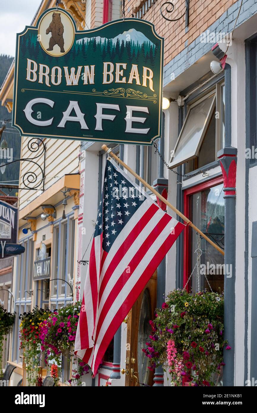 Suspended US flag and street sign for the Brown Bear Cafe, Greene ...