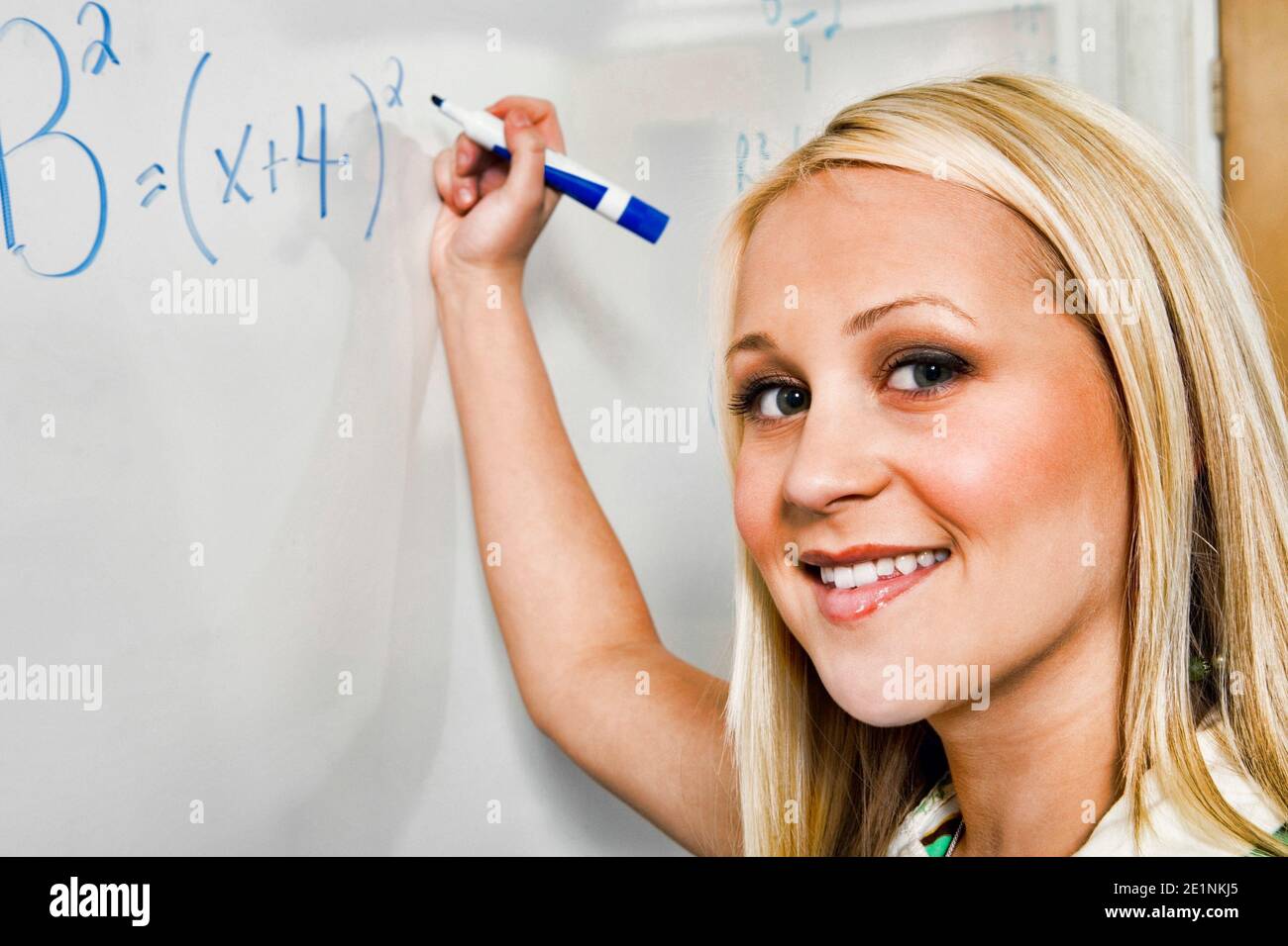 Closeup portrait of beautiful student solving algebra equation on ...
