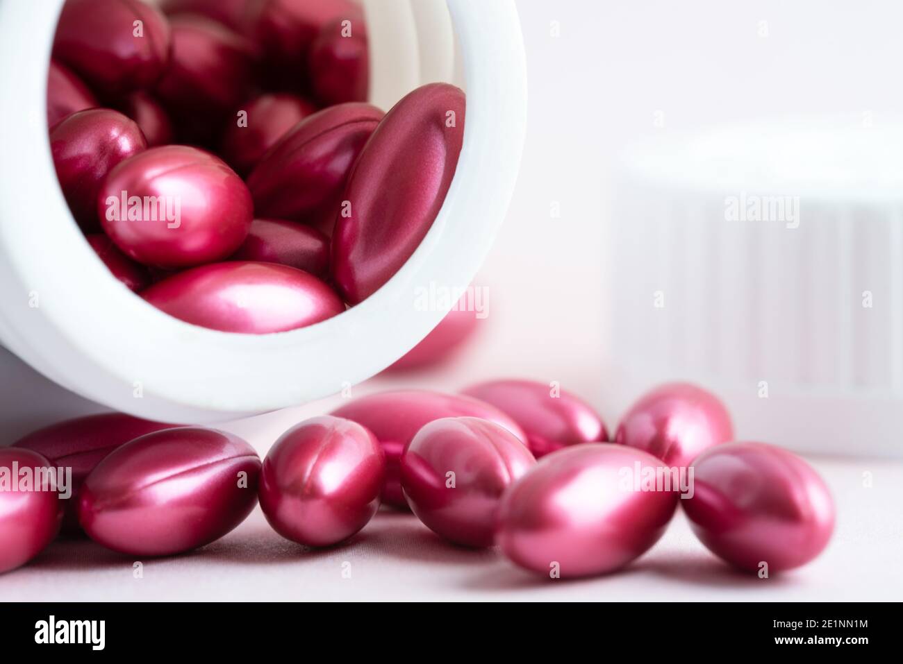 Collagen Softgels Spilled from a Bottle Stock Photo - Alamy