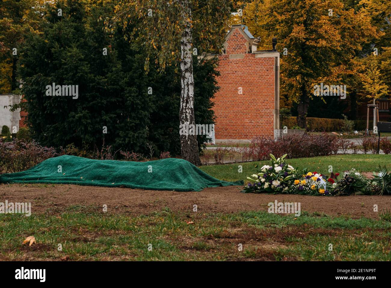 A fresh grave after a funeral Stock Photo - Alamy