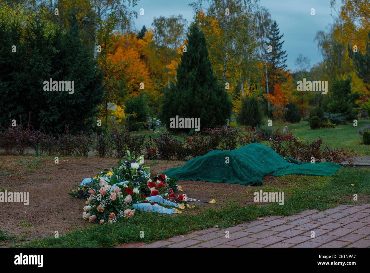 A fresh grave after a funeral Stock Photo - Alamy