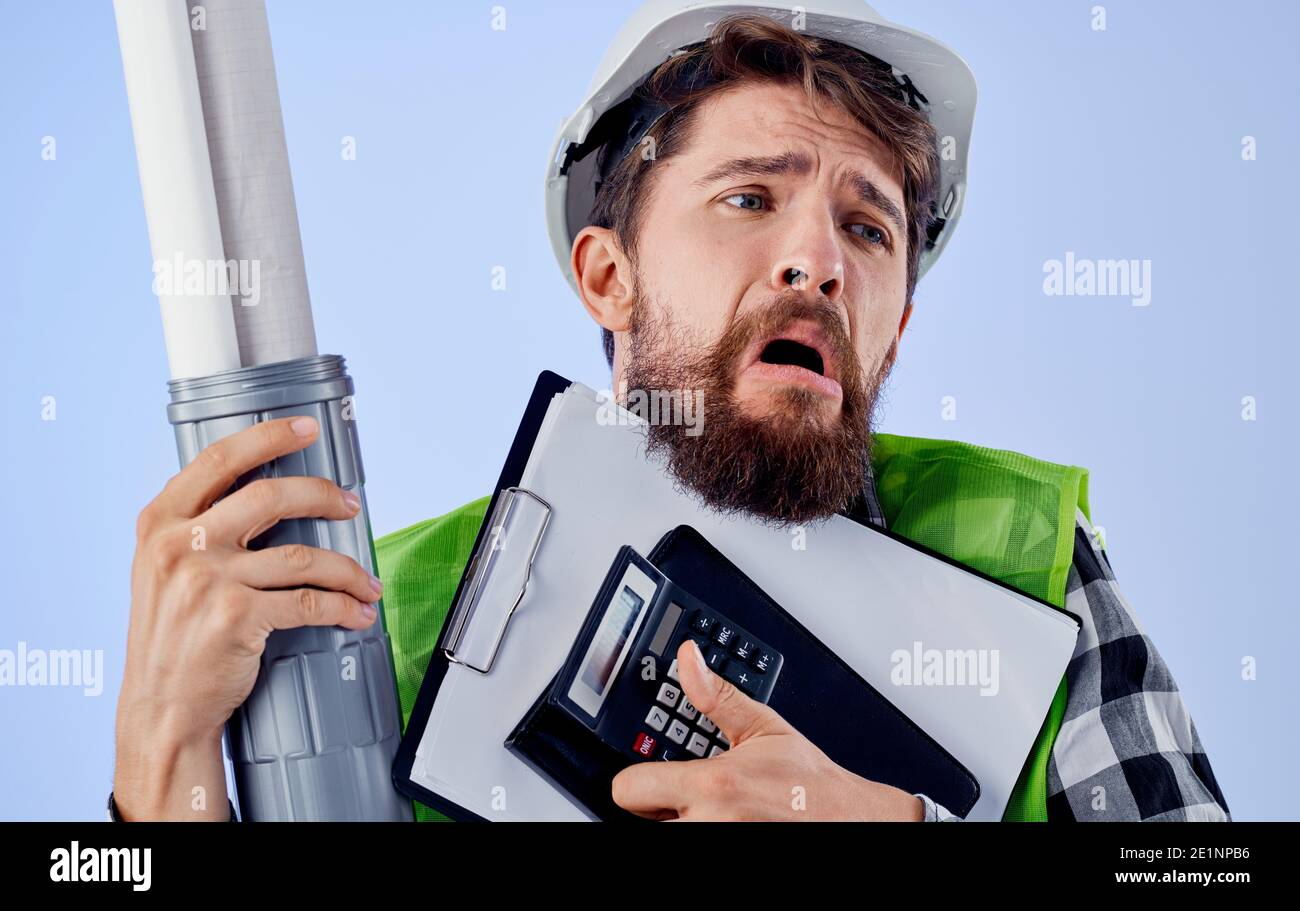 engineer with blueprints in hands construction industry profession blue ...