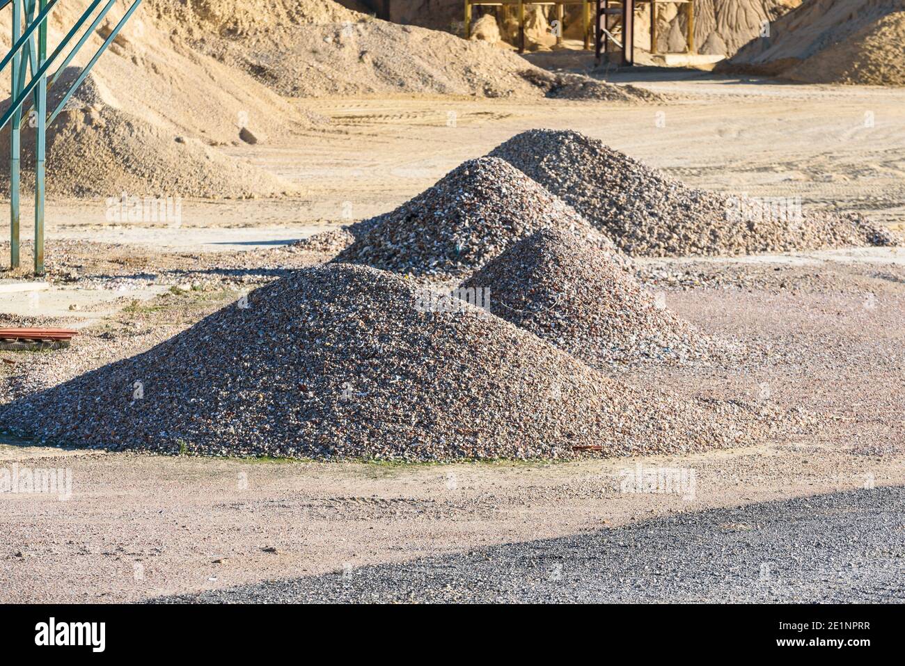 Velt conveyors and a piles of rubble in gravel quarry, crushed sand in ...