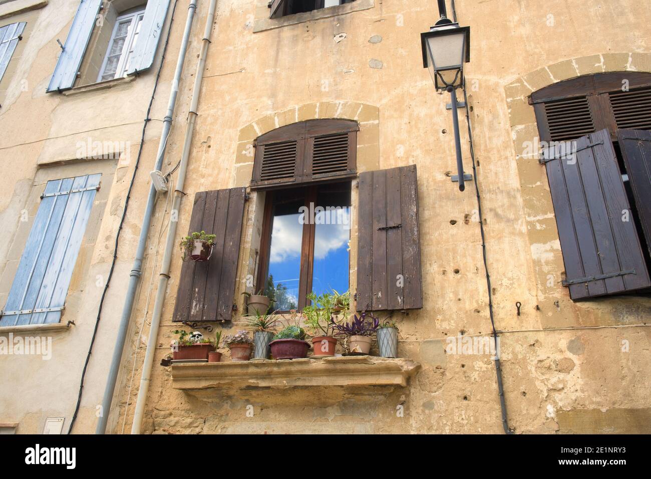 Typical French window with shutters and plants Stock Photo - Alamy