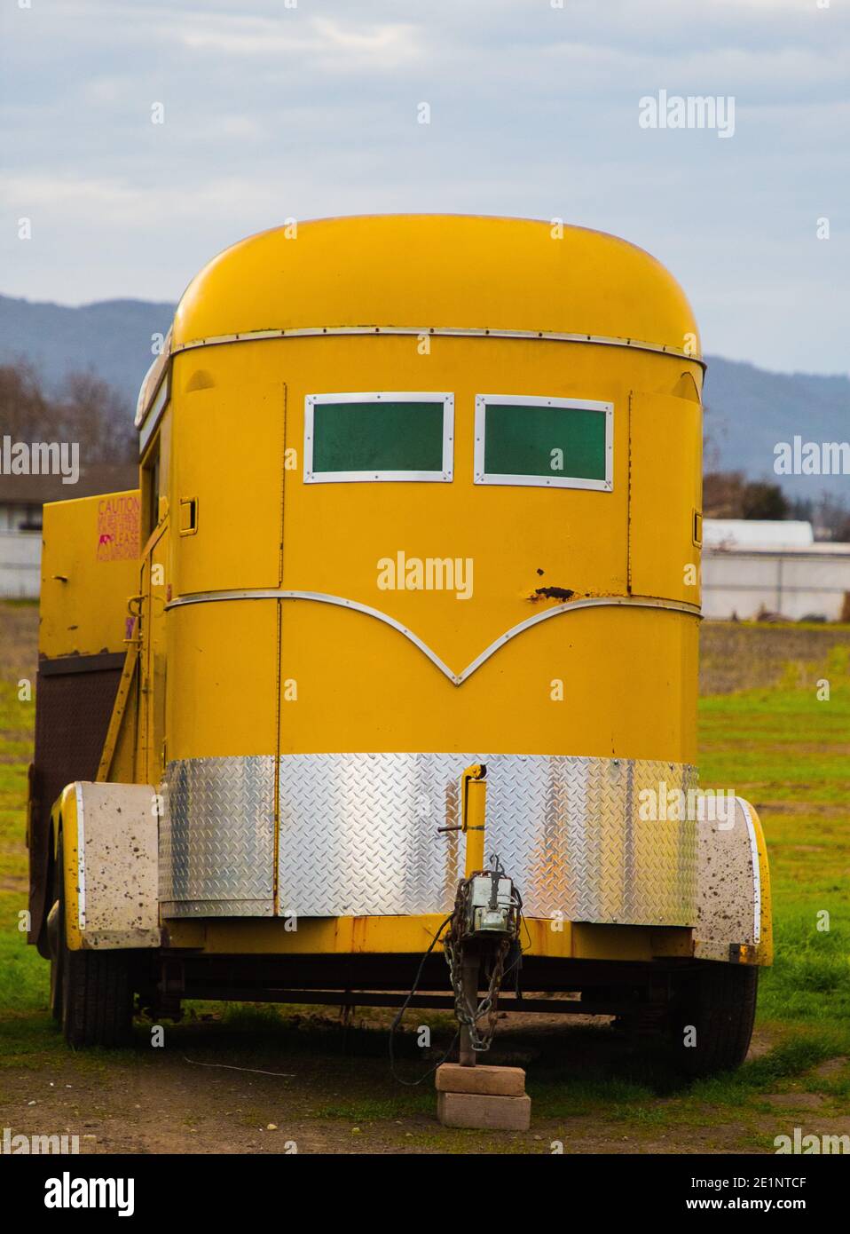 A yellow Horse trailer Stock Photo - Alamy