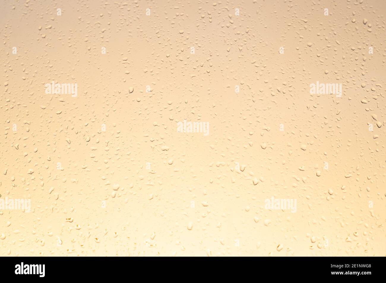 light yellow glass background with raindrops, autumn sunset, texture ...