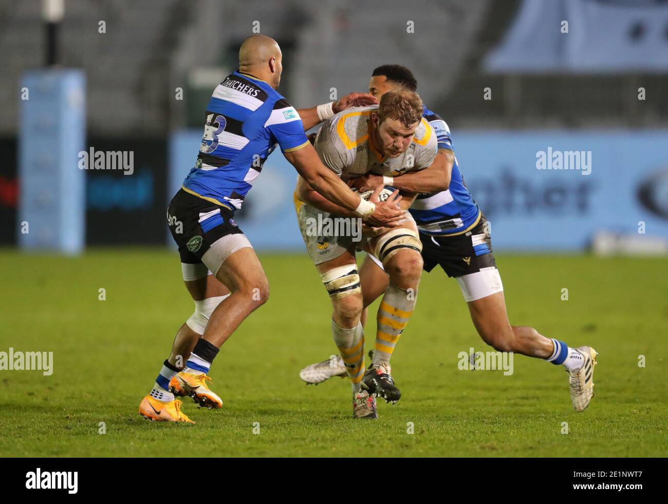 Wasps' Joe Launchbury is tackled by Bath Rugby's Jonathan Joseph (left ...