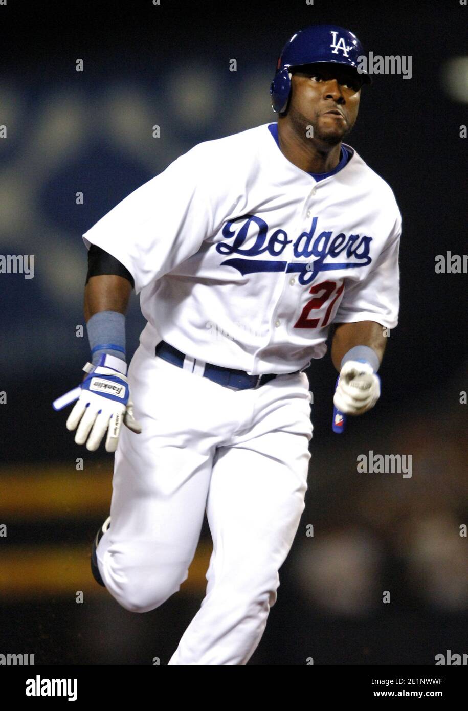 Milton Bradley of the Los Angeles Dodgers sprints toward third base ...