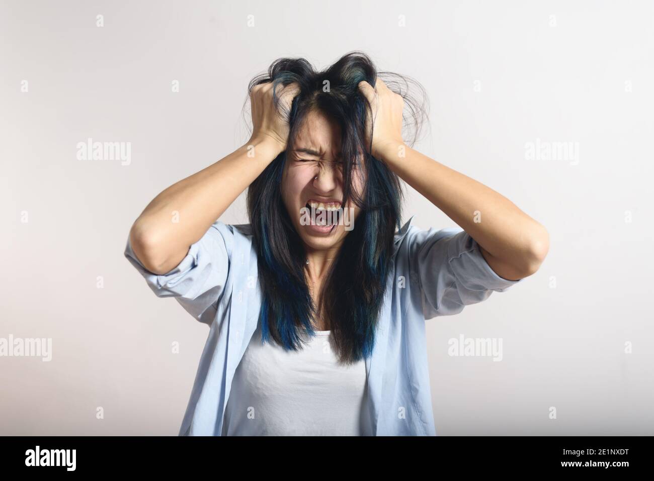 Crying emotional stressed woman covering her ears and screaming on ...