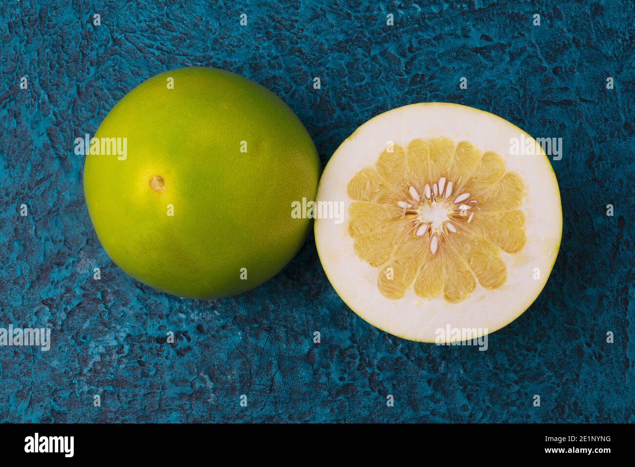 Pomelo citrus fruit over bright background Stock Photo - Alamy