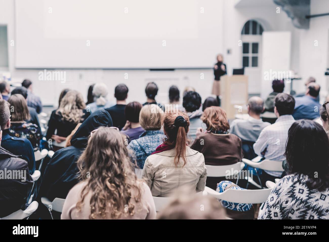 Woman giving presentation on business conference Stock Photo - Alamy