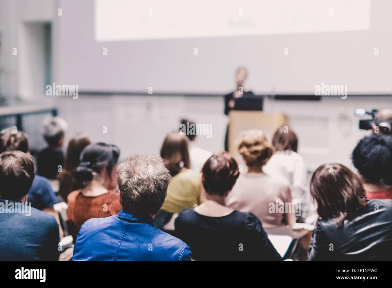 Female speaker giving presentation on business conference Stock Photo ...