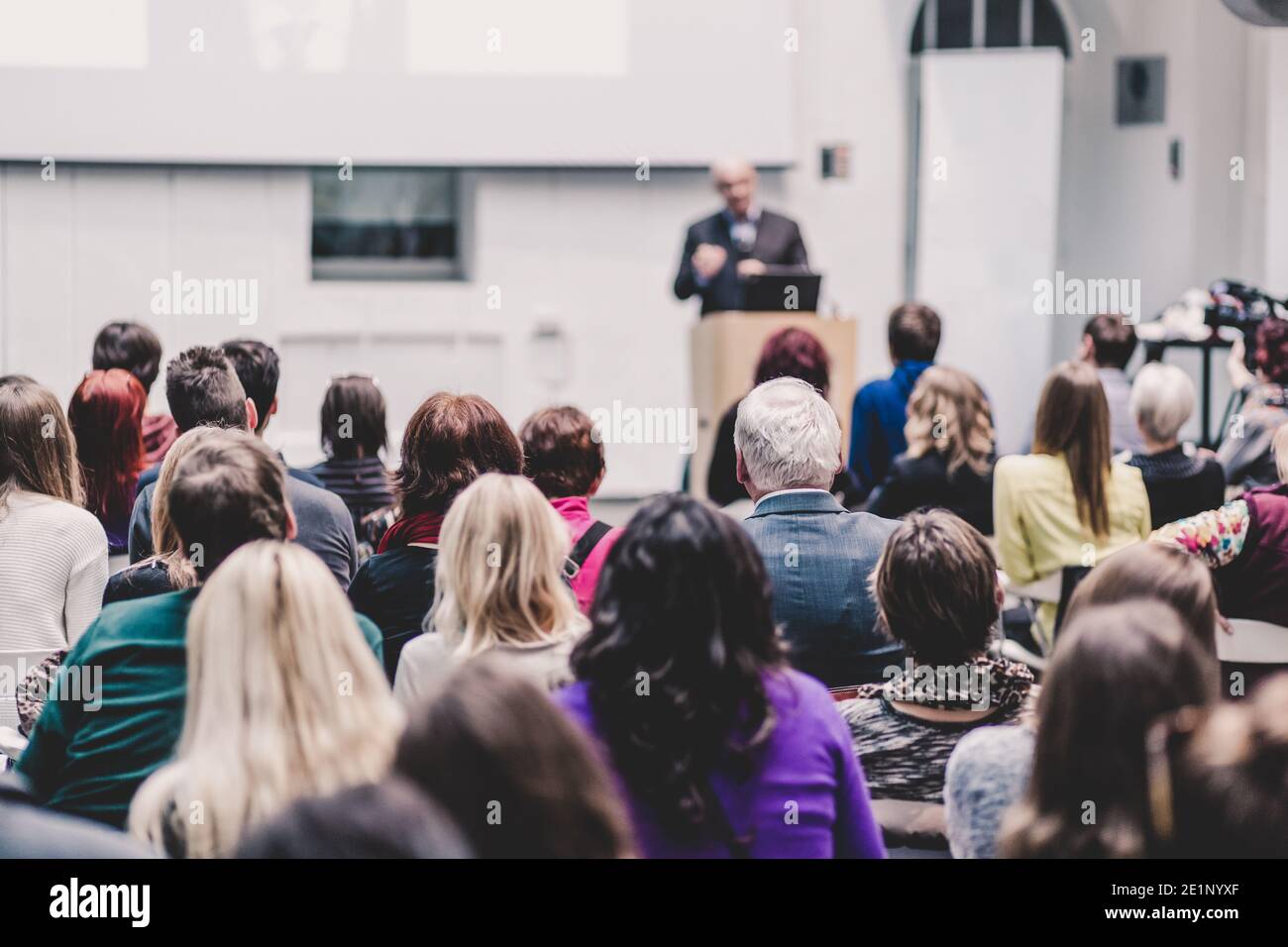 Man giving presentation in lecture hall at university Stock Photo - Alamy