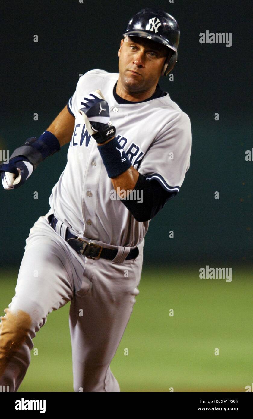 Derek Jeter of the New York Yankees rounds second base during 8-6 loss ...