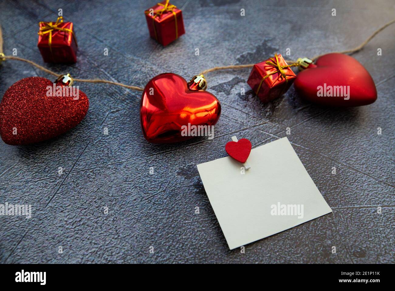 red hearts and white card for valentine's day text Stock Photo - Alamy