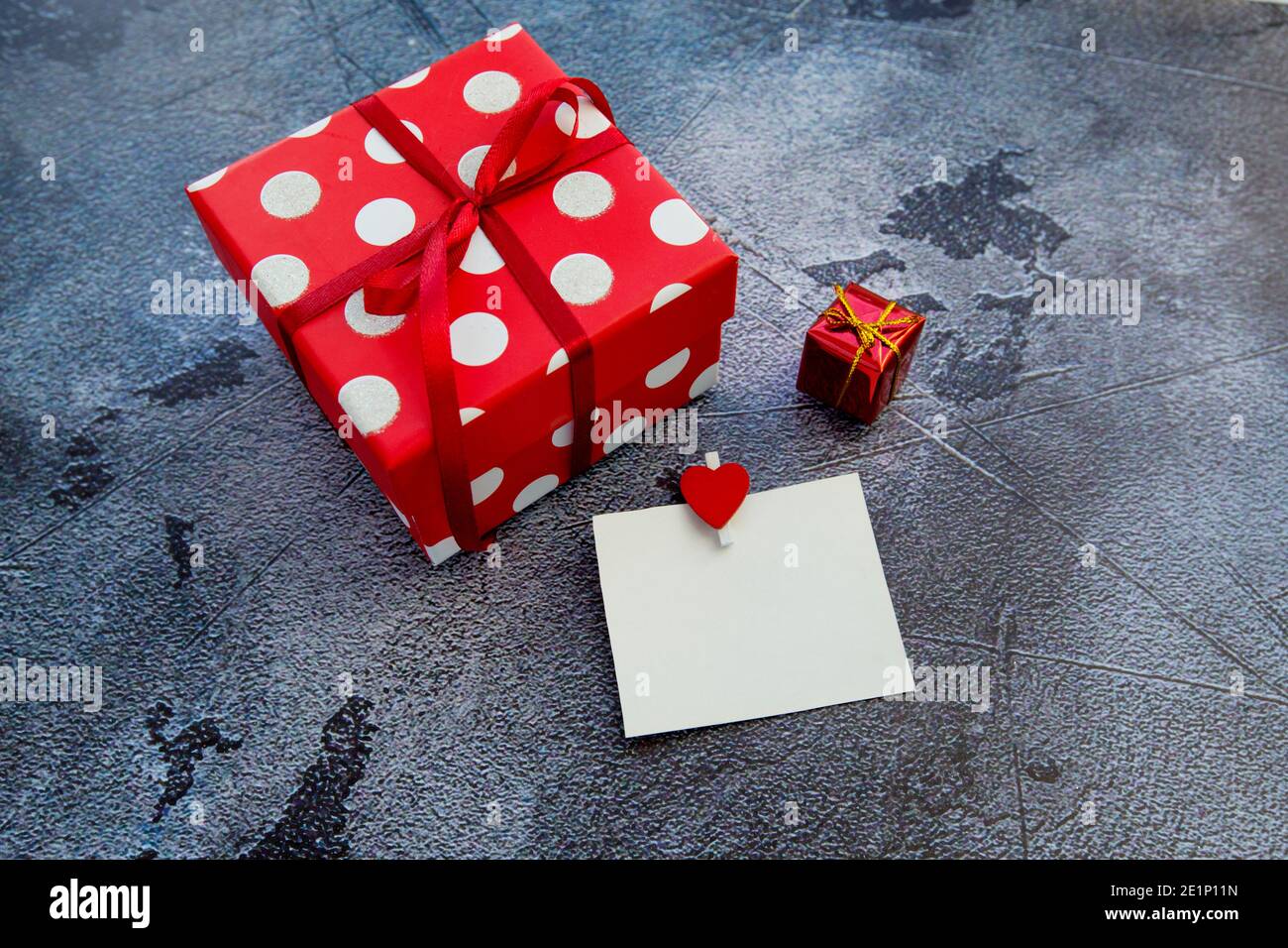 red hearts and white card for valentine's day text Stock Photo - Alamy