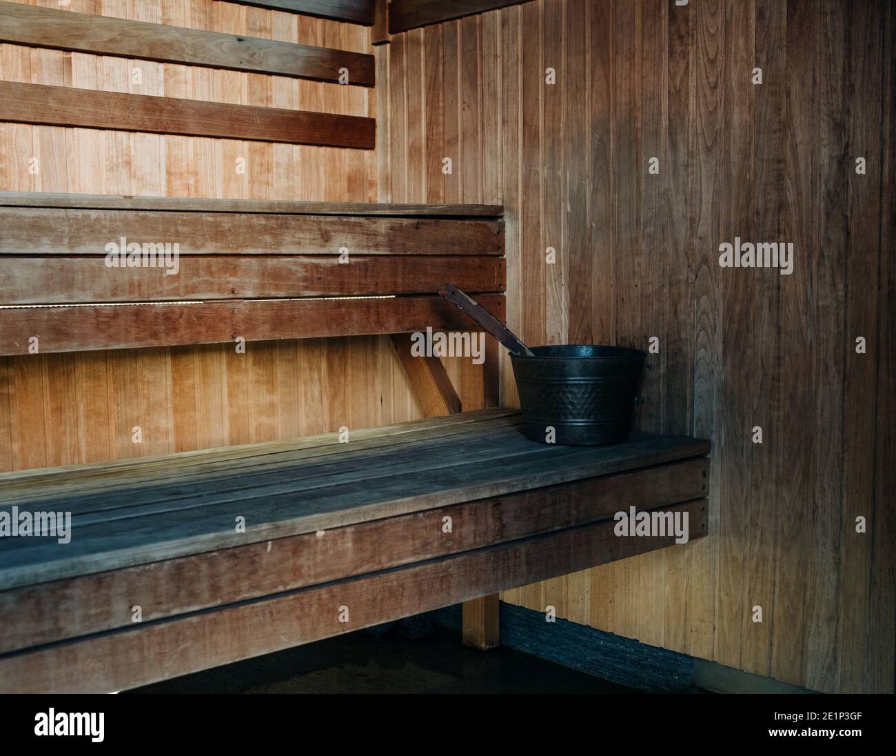 Traditional wooden Scandinavian sauna with water bucket Stock Photo - Alamy