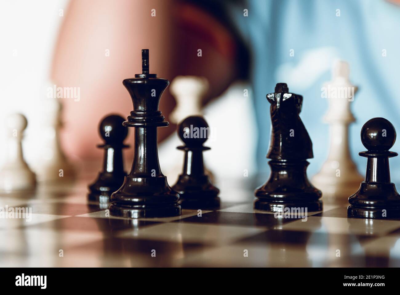 Chess pieces on chessboard. Playing chess at home. Narrow depth of ...