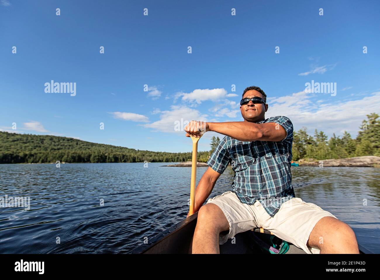 African man paddling canoe on hi-res stock photography and images - Alamy