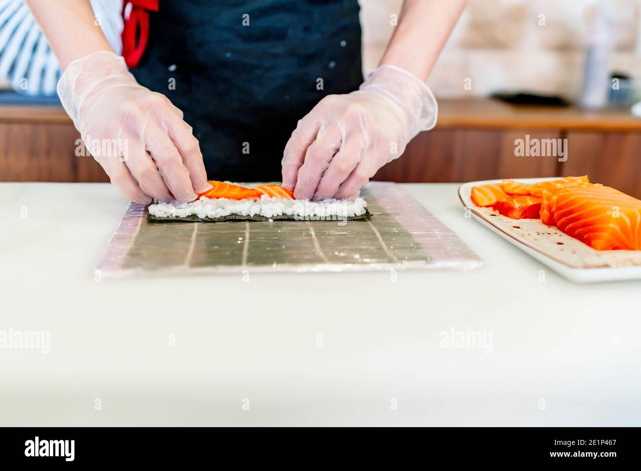 Japanese chef making sushi rolling hi-res stock photography and images ...
