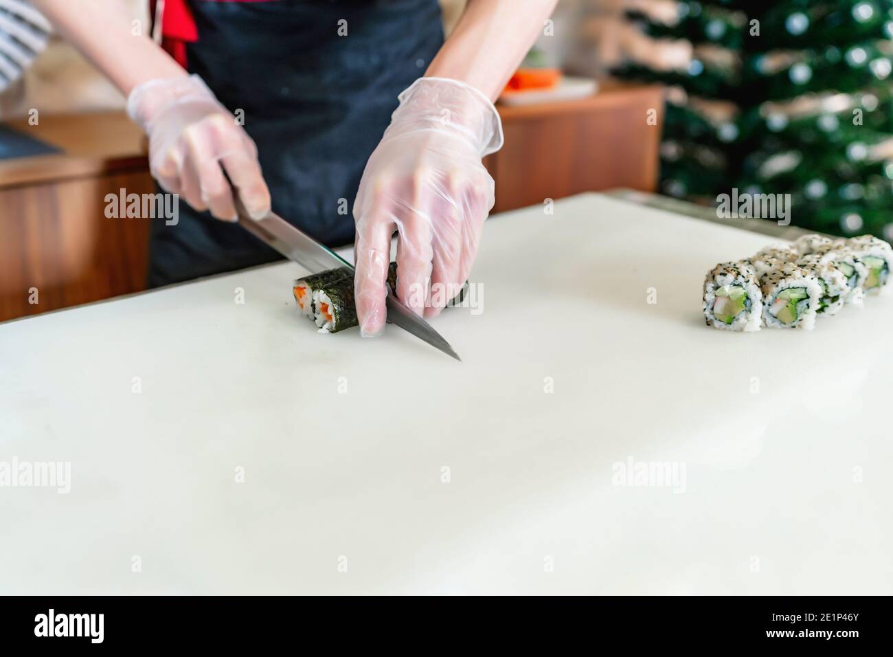 Cutting sushi hi-res stock photography and images - Alamy
