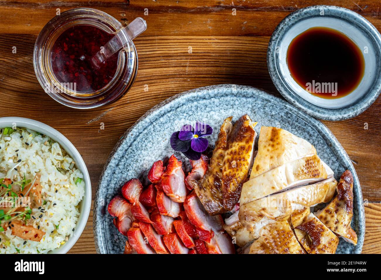 roast meat Asian style with rice and sauce Stock Photo - Alamy