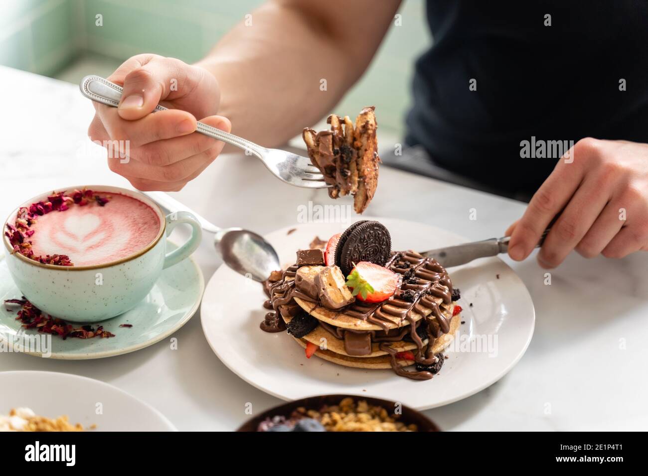 fork full of pancake with hands Stock Photo - Alamy