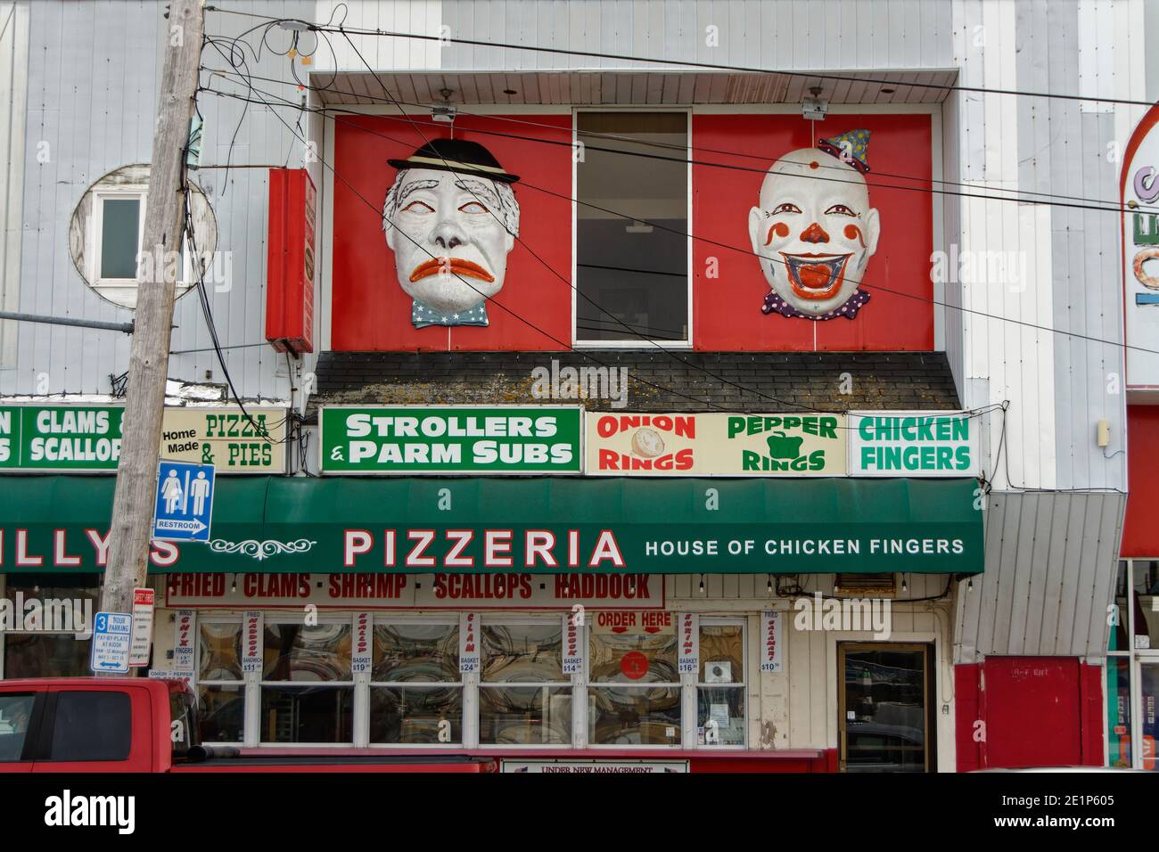 Sad and happy clown faces decorate the exterior walls of a classic ...