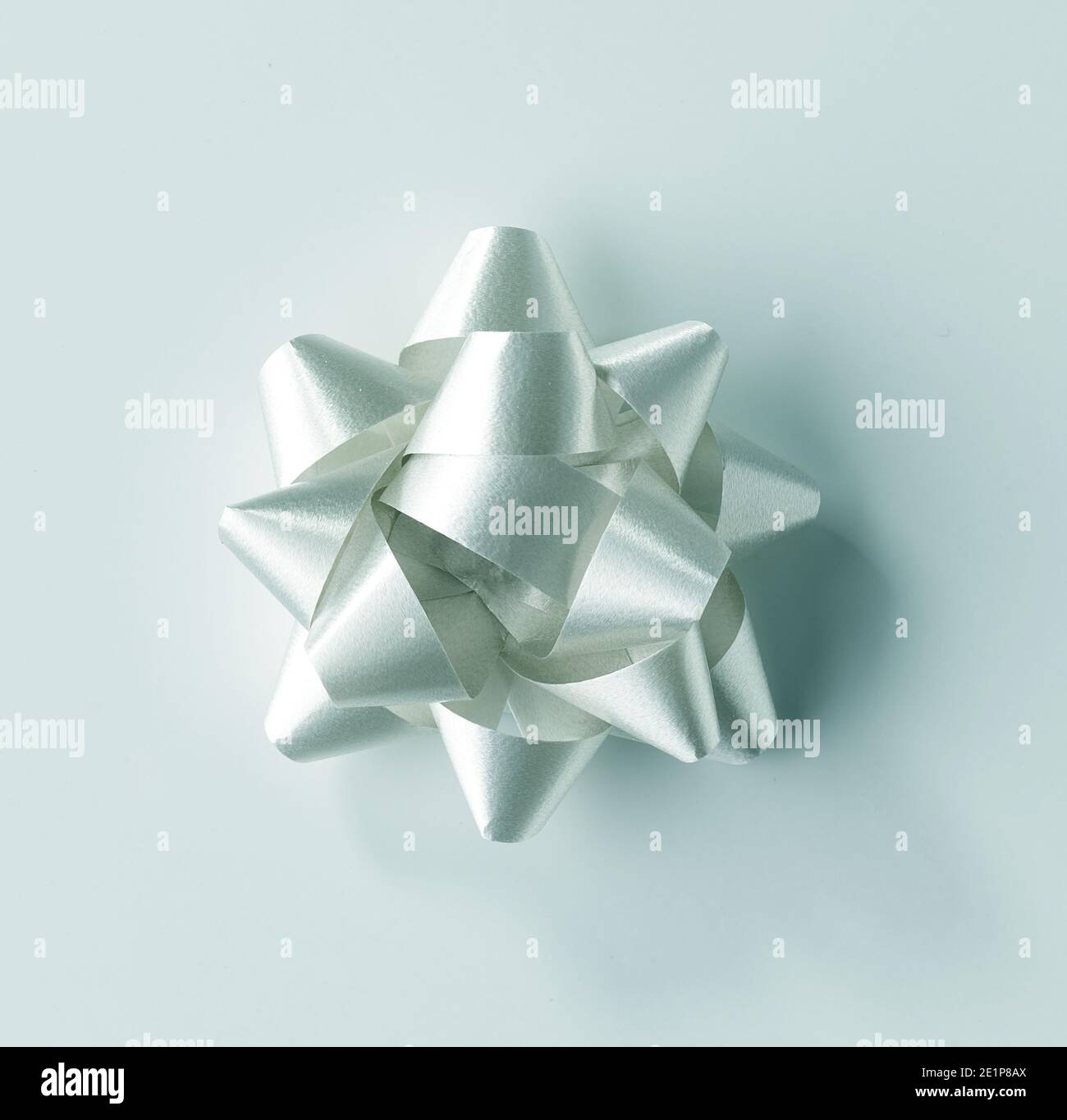 paper ribbon bow decoration, top view Stock Photo - Alamy