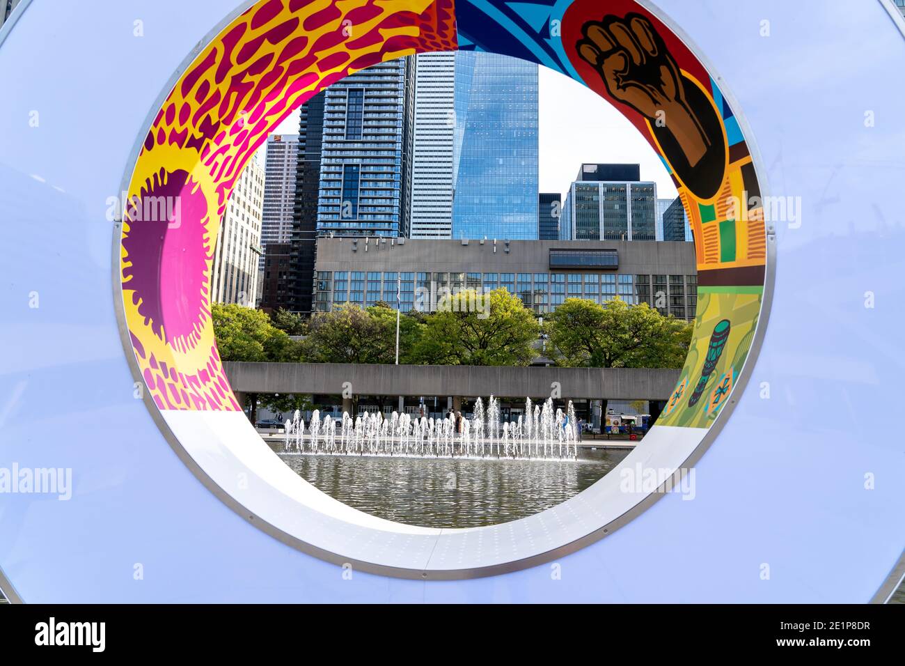 Buildings and fountain are seen through the letter "O" in new 'Toronto ...
