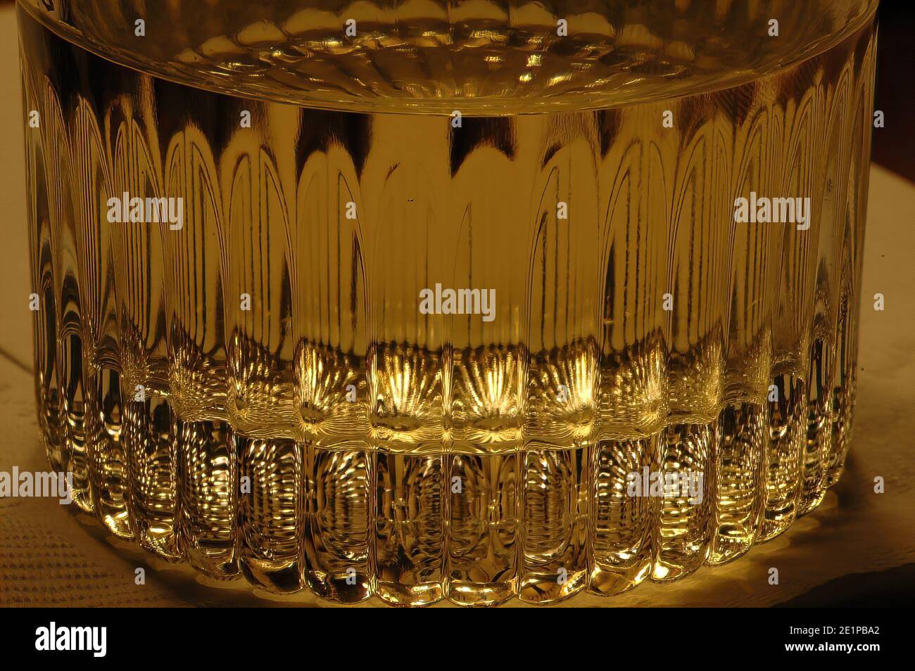 A short study in light refraction using white wine in a clear glass ...