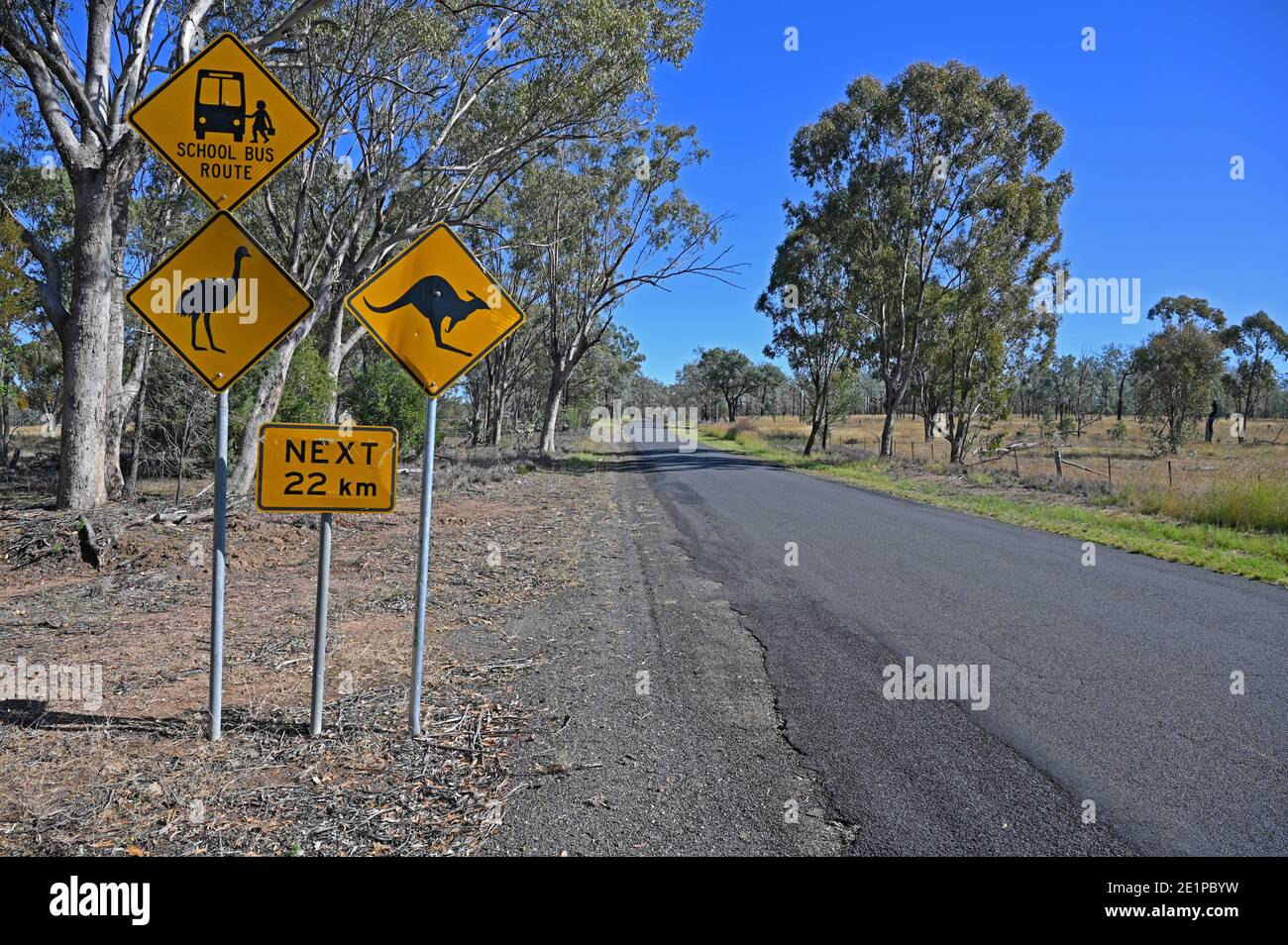Trees next to road sign hi-res stock photography and images - Alamy