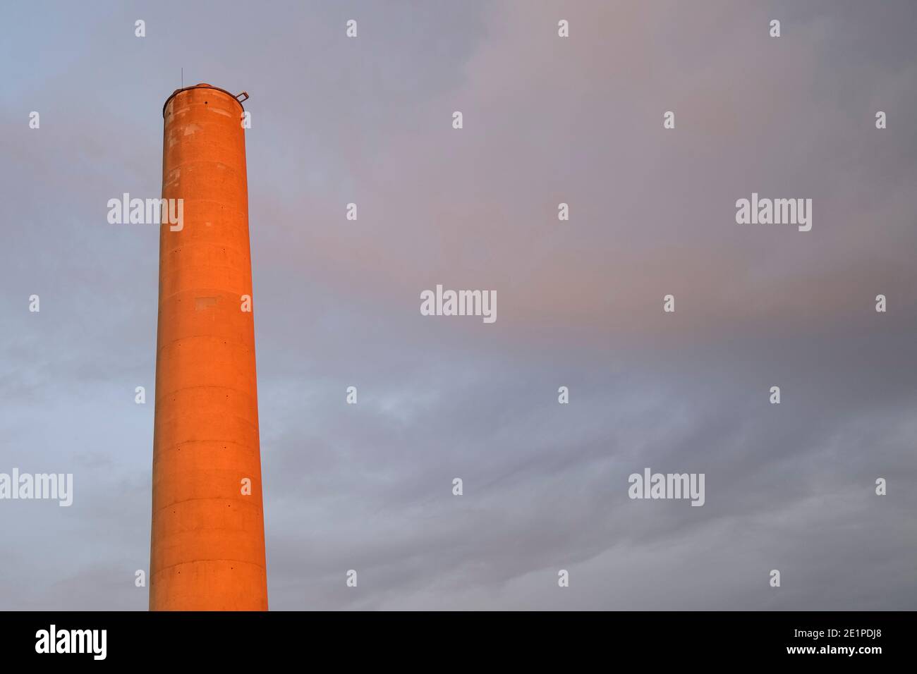 Smokestack in the afternoon light Stock Photo - Alamy
